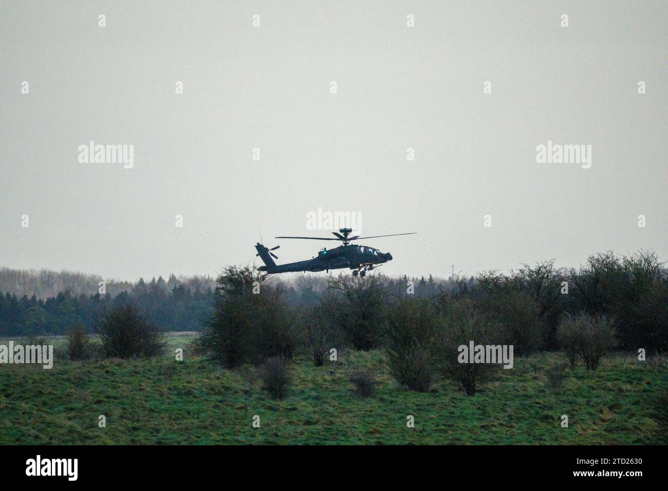 British army Apache AH64E AH-64E Helicopter Gunship in low level fligth ...