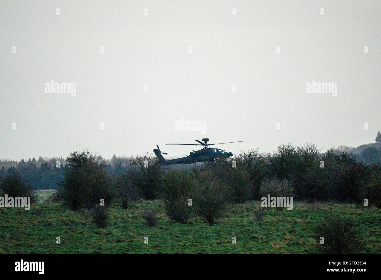 British army Apache AH64E AH-64E Helicopter Gunship in low level fligth ...