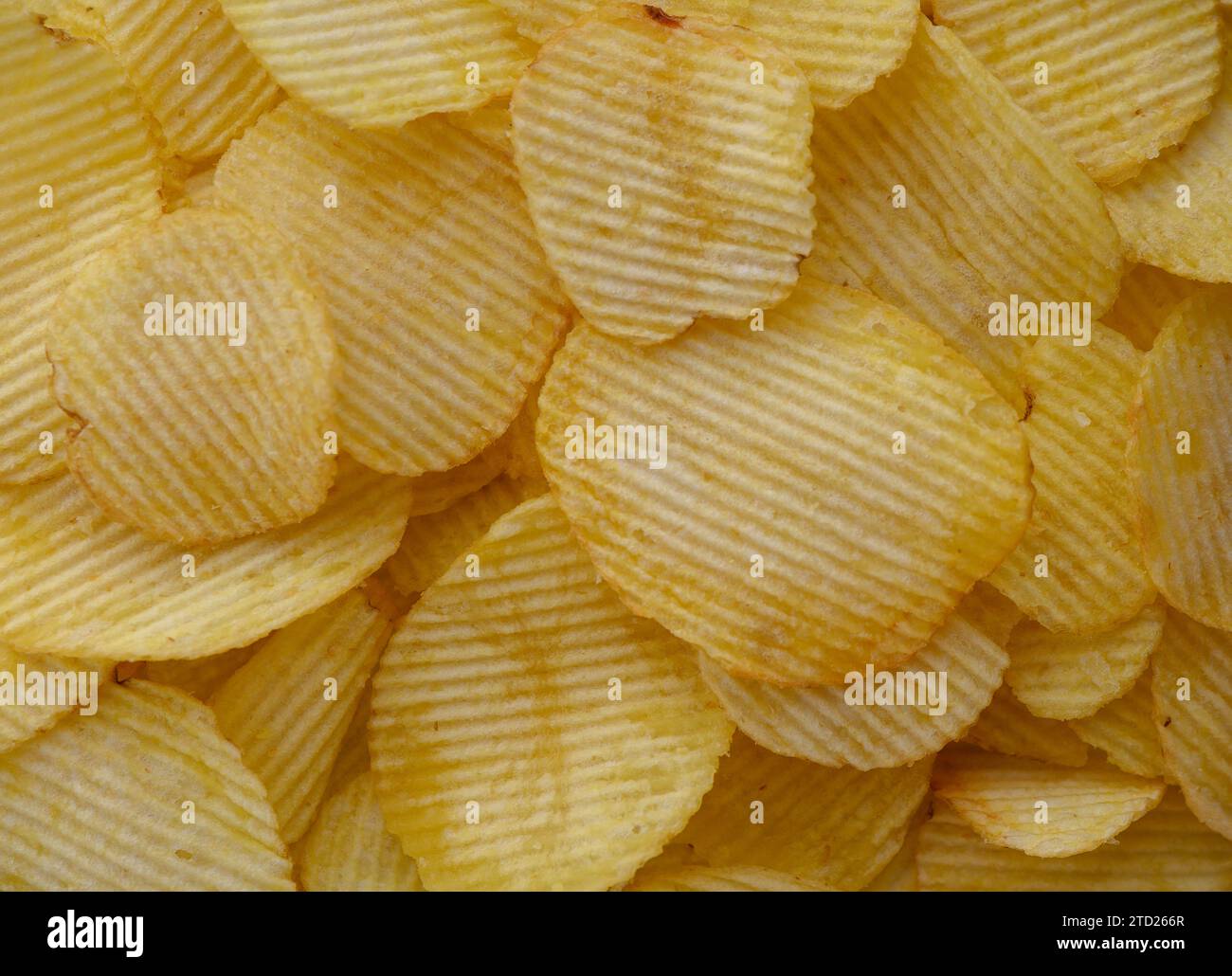 food background from delicious chips poured out of a pack 1 Stock Photo ...