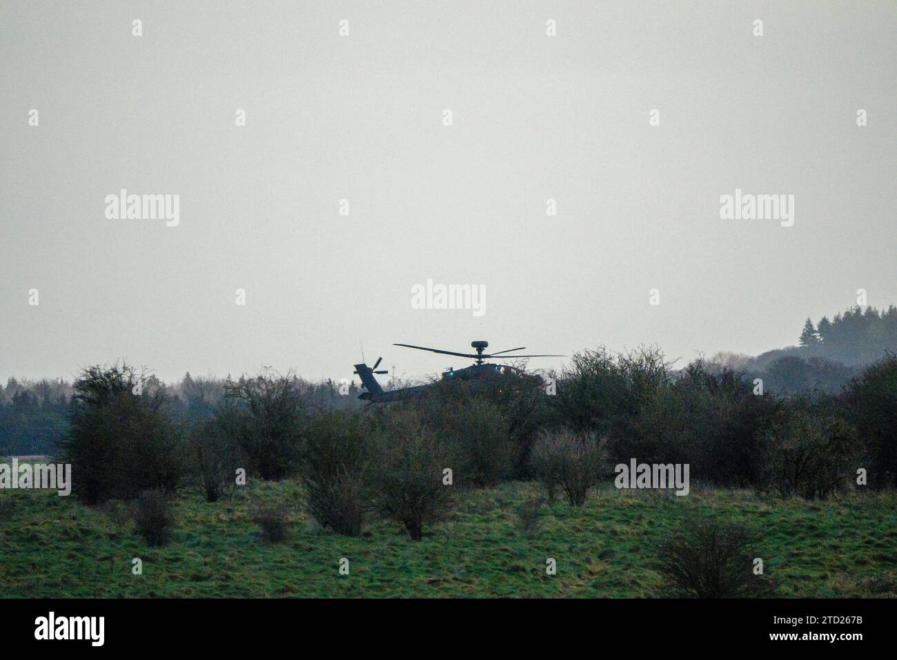 British army Apache AH64E AH-64E Helicopter Gunship in low level fligth ...