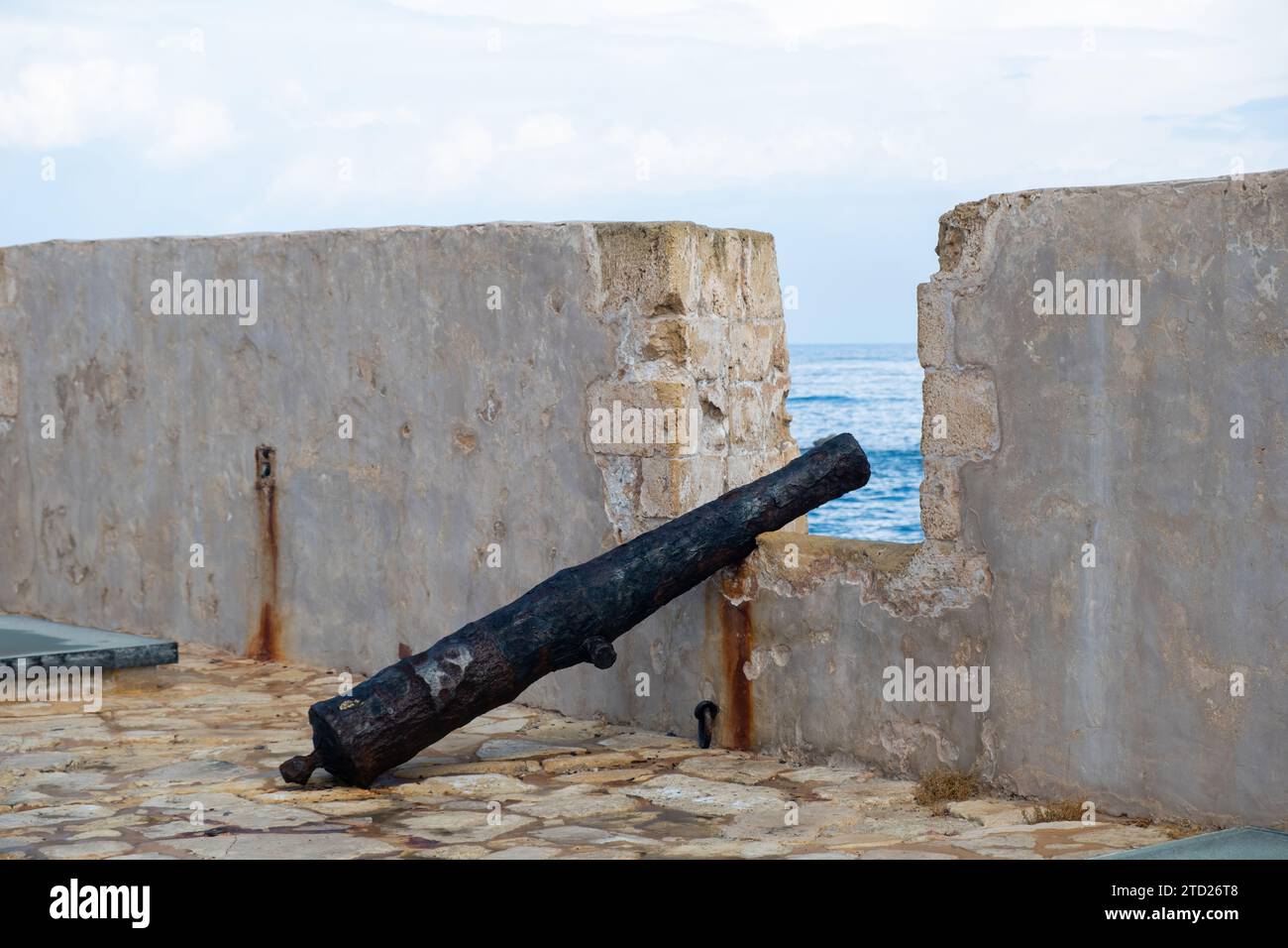 Antique cannon put on opening of Firkas Fortress worn wall at Old Town ...
