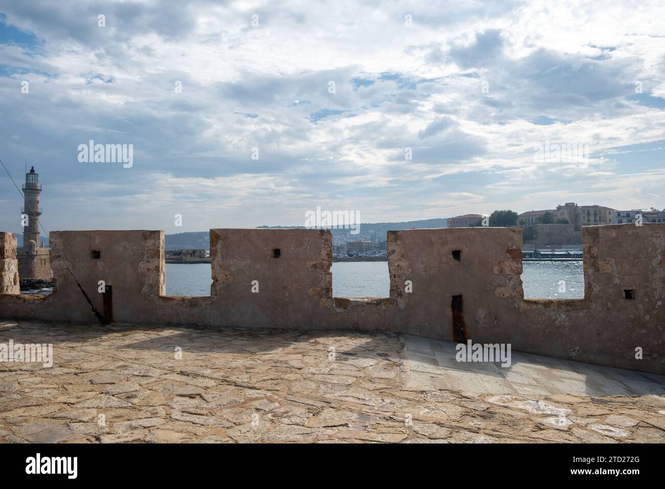 Lighthouse at Venetian port, Old Town of Chania Crete, Greece. Calm sea ...