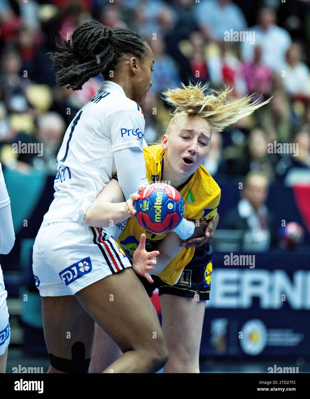 Tyra Axner from Sweden is tackled in the IHF World Womens Handball ...