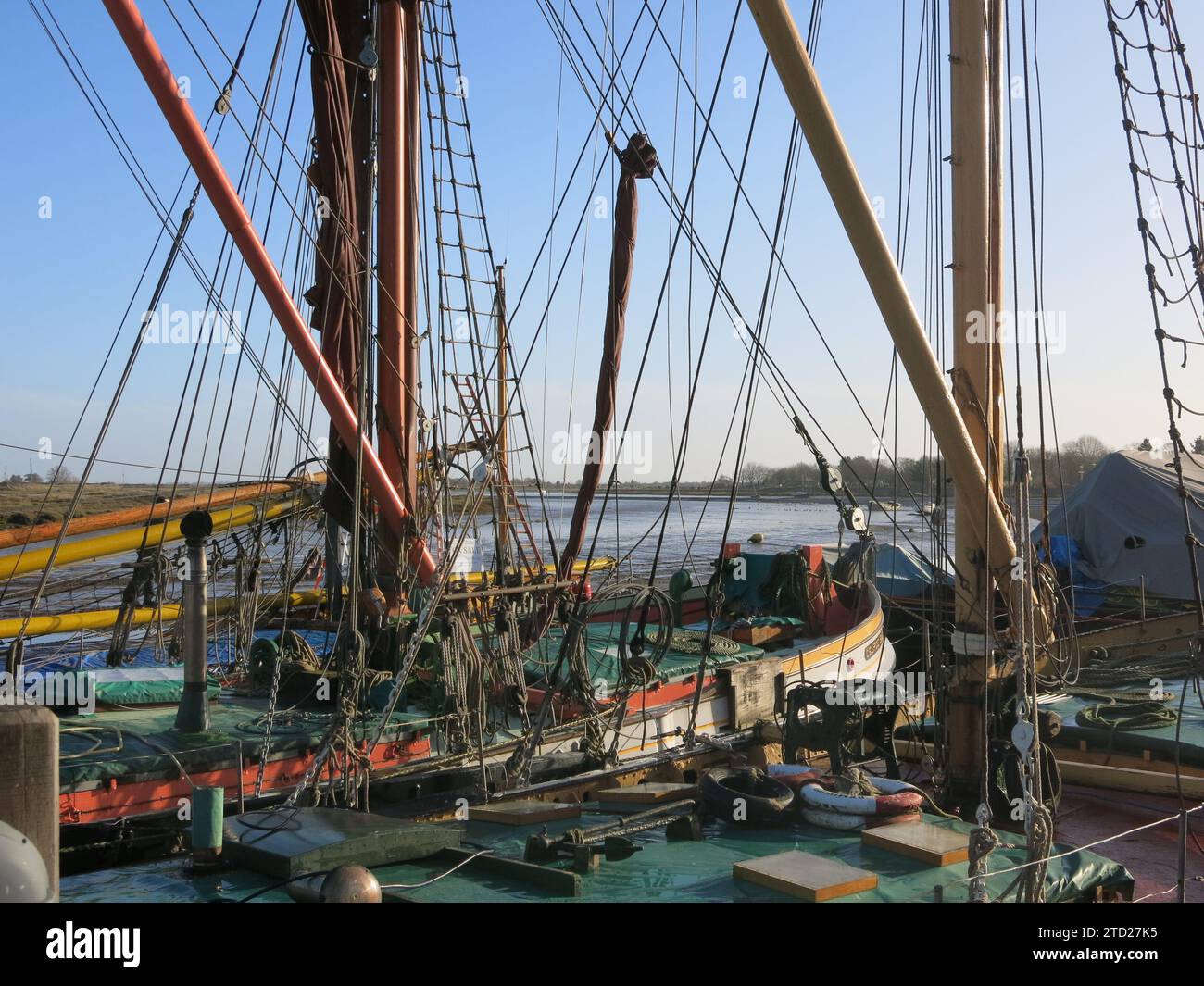 East coast sailing barges with their tall masts and rigging, moored ...