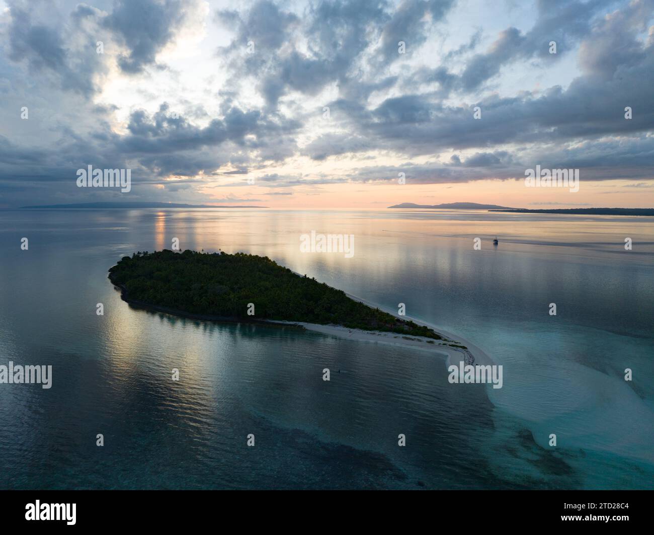 Sunrise illuminates the remote island of Koon near Seram, Indonesia ...