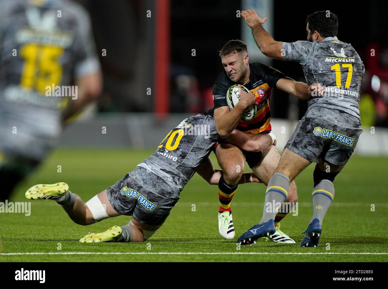 Gloucester Rugby's Max Llewellyn is tackled by Clermont Auvergne's ...