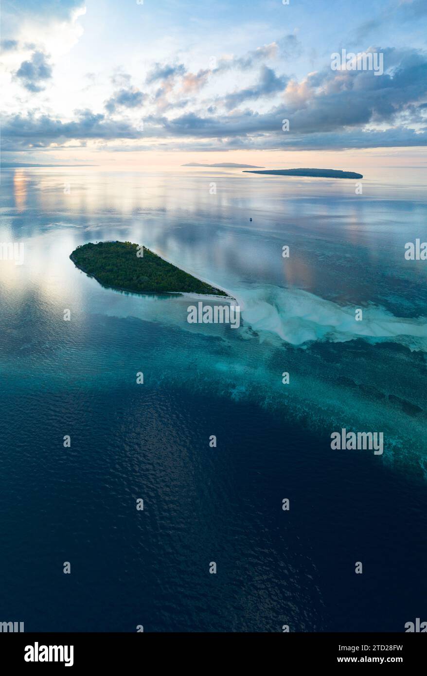 Sunrise illuminates the remote island of Koon near Seram, Indonesia ...