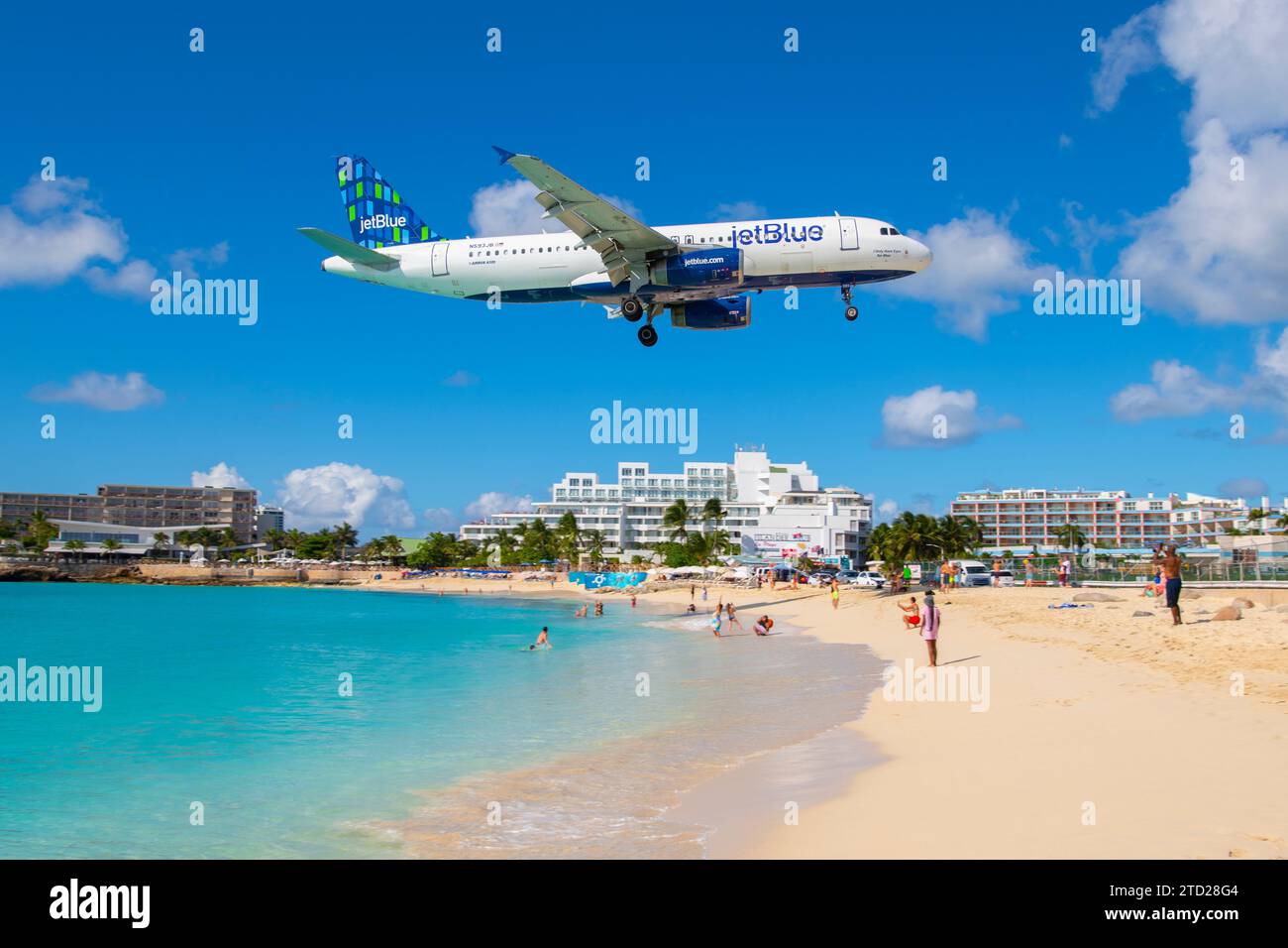 JetBlue Airways Airbus 320 flying over Maho Beach before landing on ...
