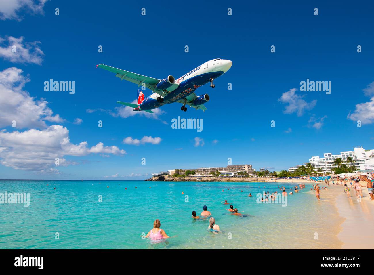 JetBlue Airways Airbus 320 flying over Maho Beach before landing on ...