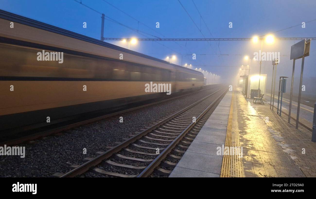 Night train in the fog. Station in fog and darkness. Passage of express ...