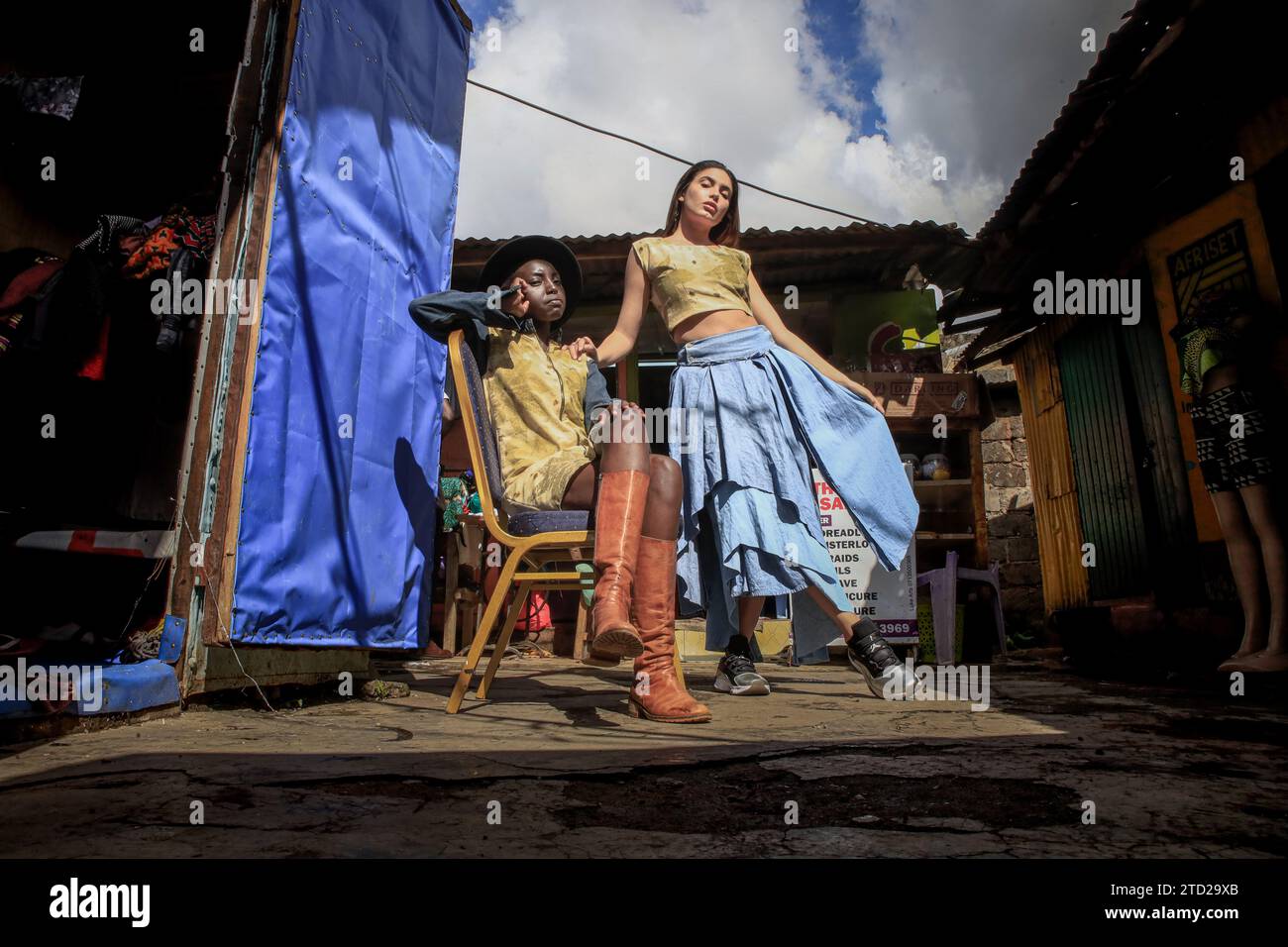 Models are posed dressed in outfits designed by Afrowema for the Just ...