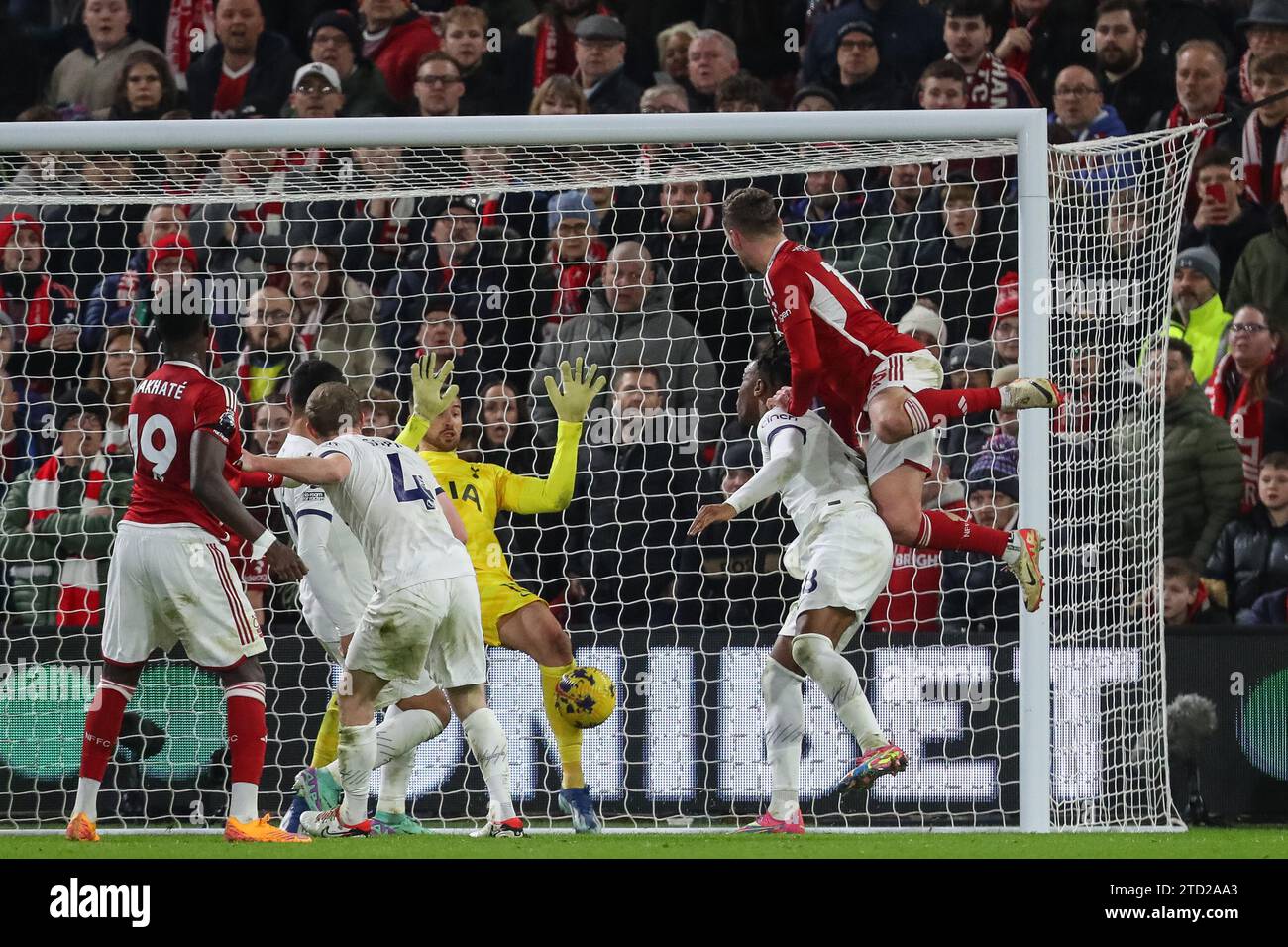 Guglielmo Vicario #13 of Tottenham Hotspur saves a header from Harry ...