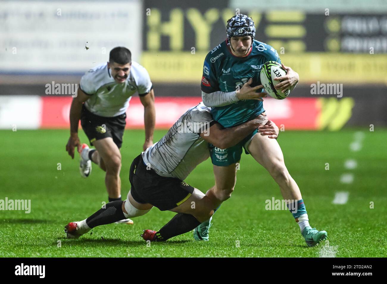 Tom Rogers of Scarlets is tackled by Nodar Cheishvili of Black Lion ...