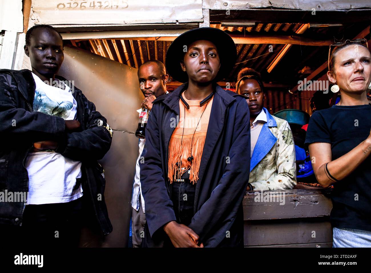 Models are posed for a photo outside Richard Onyango's stall dressed in ...