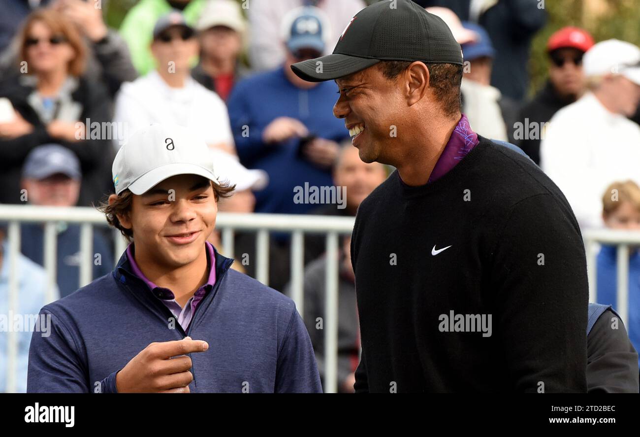 Tiger Woods and his son, Charlie Woods, share a laugh before teeing off ...
