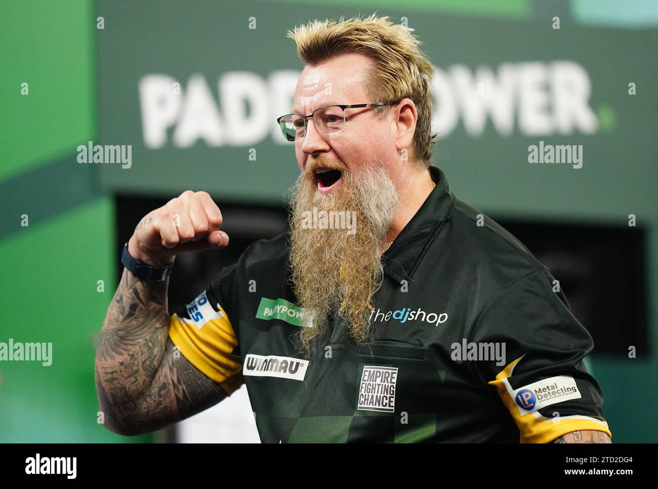 Simon Whitlock reacts after beating Paolo Nebrida (not pictured) on day ...