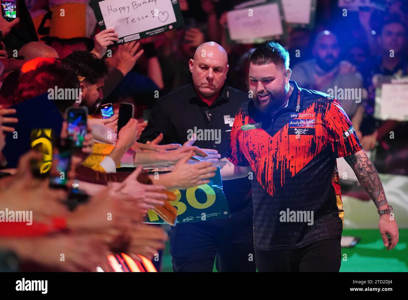 Michael Smith walks out to play Kevin Doets (not pictured) on day one ...