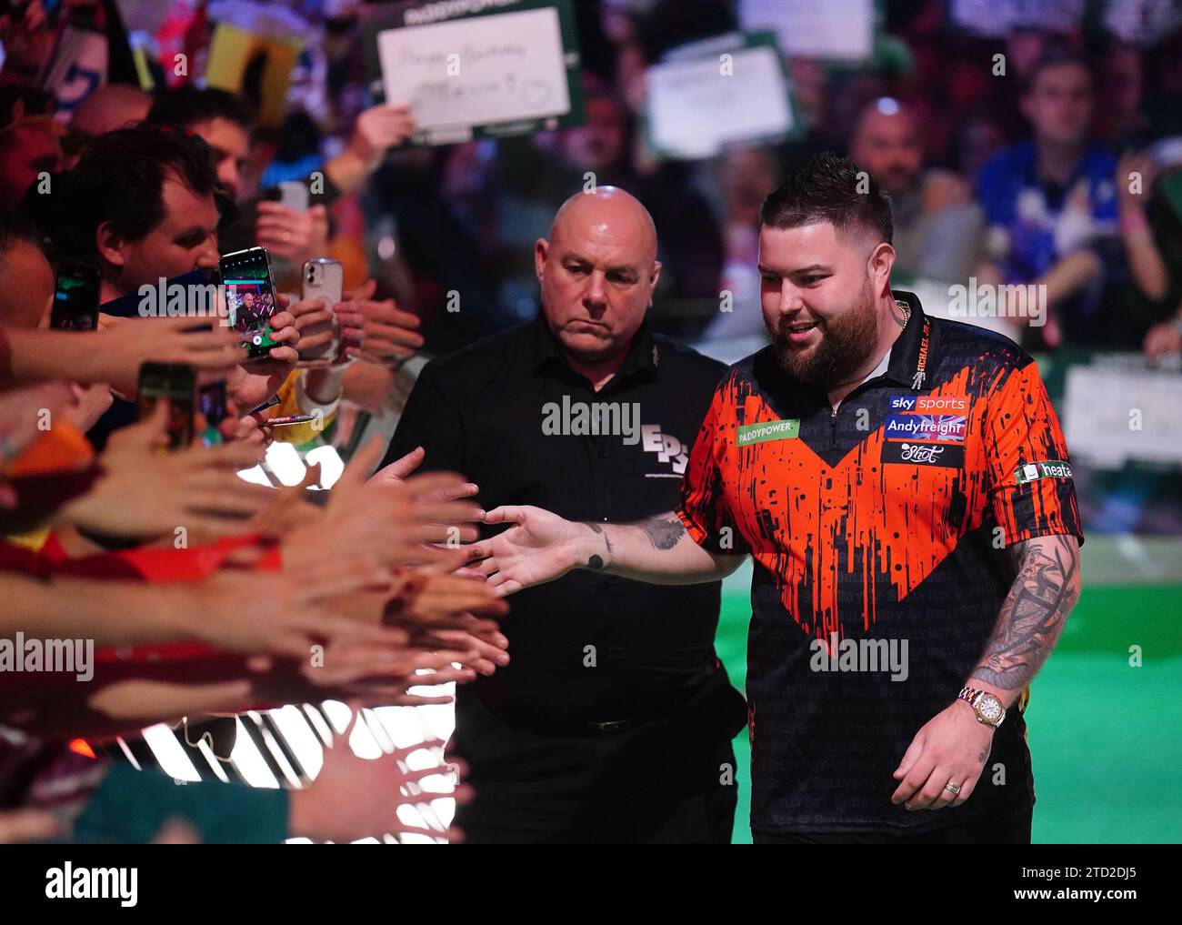 Michael Smith walks out to play Kevin Doets (not pictured) on day one ...