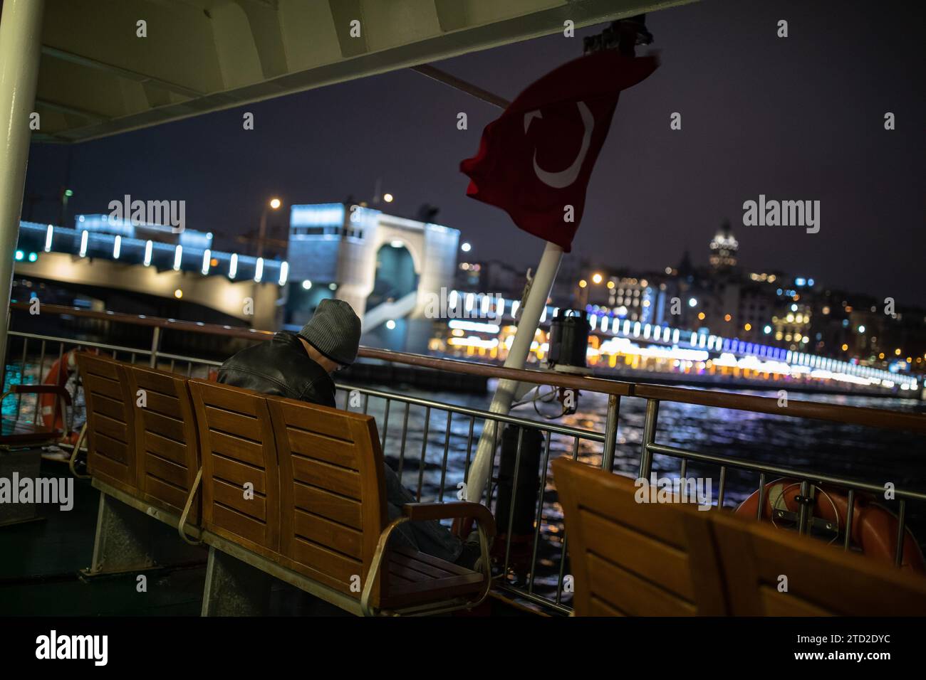 Galata Bridge seen in the background with a passenger sitting in the ...