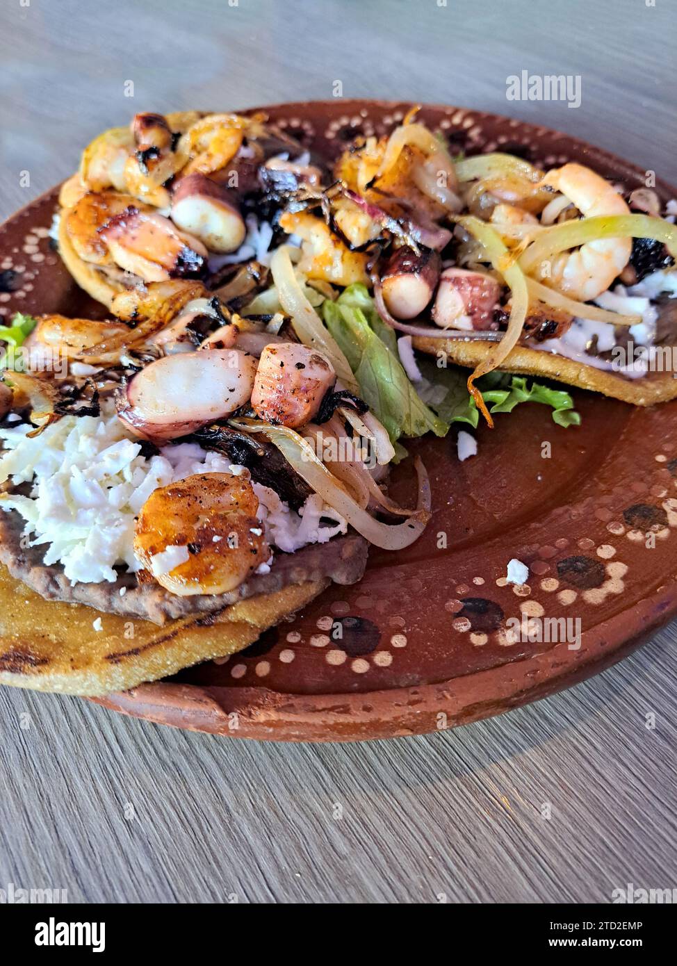 Delicious dish of Sopes and seafood tostadas that are a fried tortilla ...