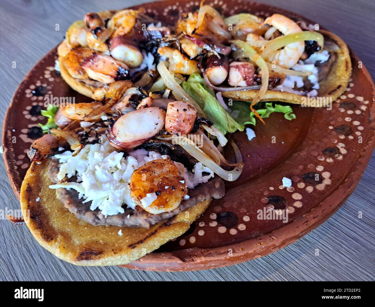 Delicious dish of Sopes and seafood tostadas that are a fried tortilla ...