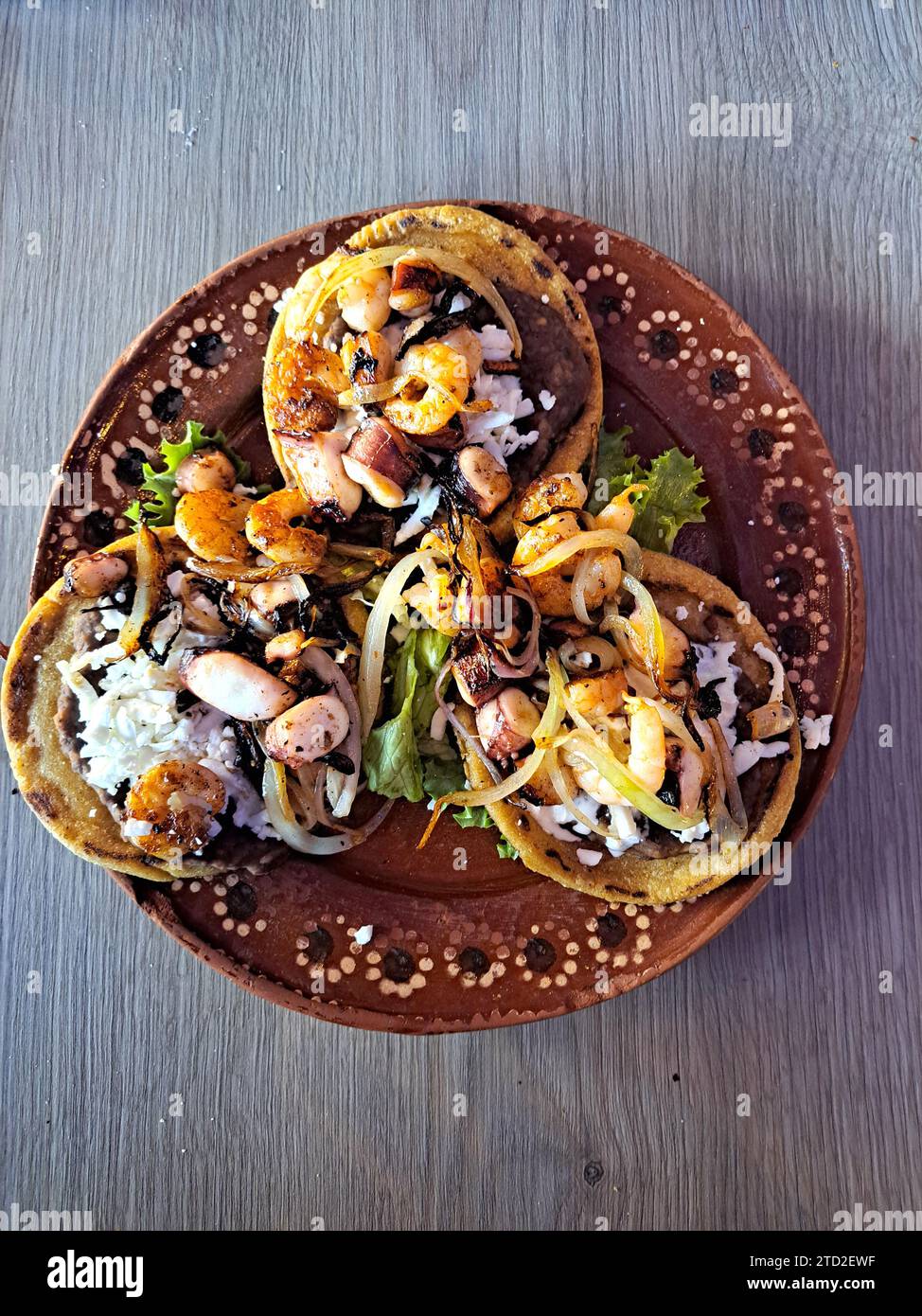 Delicious dish of Sopes and seafood tostadas that are a fried tortilla ...