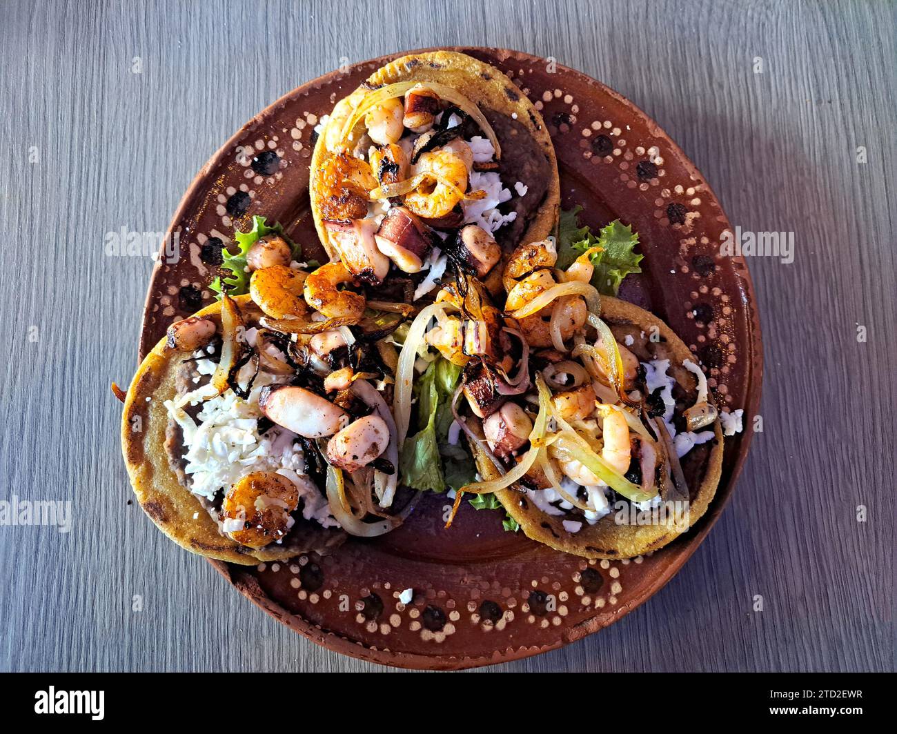 Delicious dish of Sopes and seafood tostadas that are a fried tortilla ...