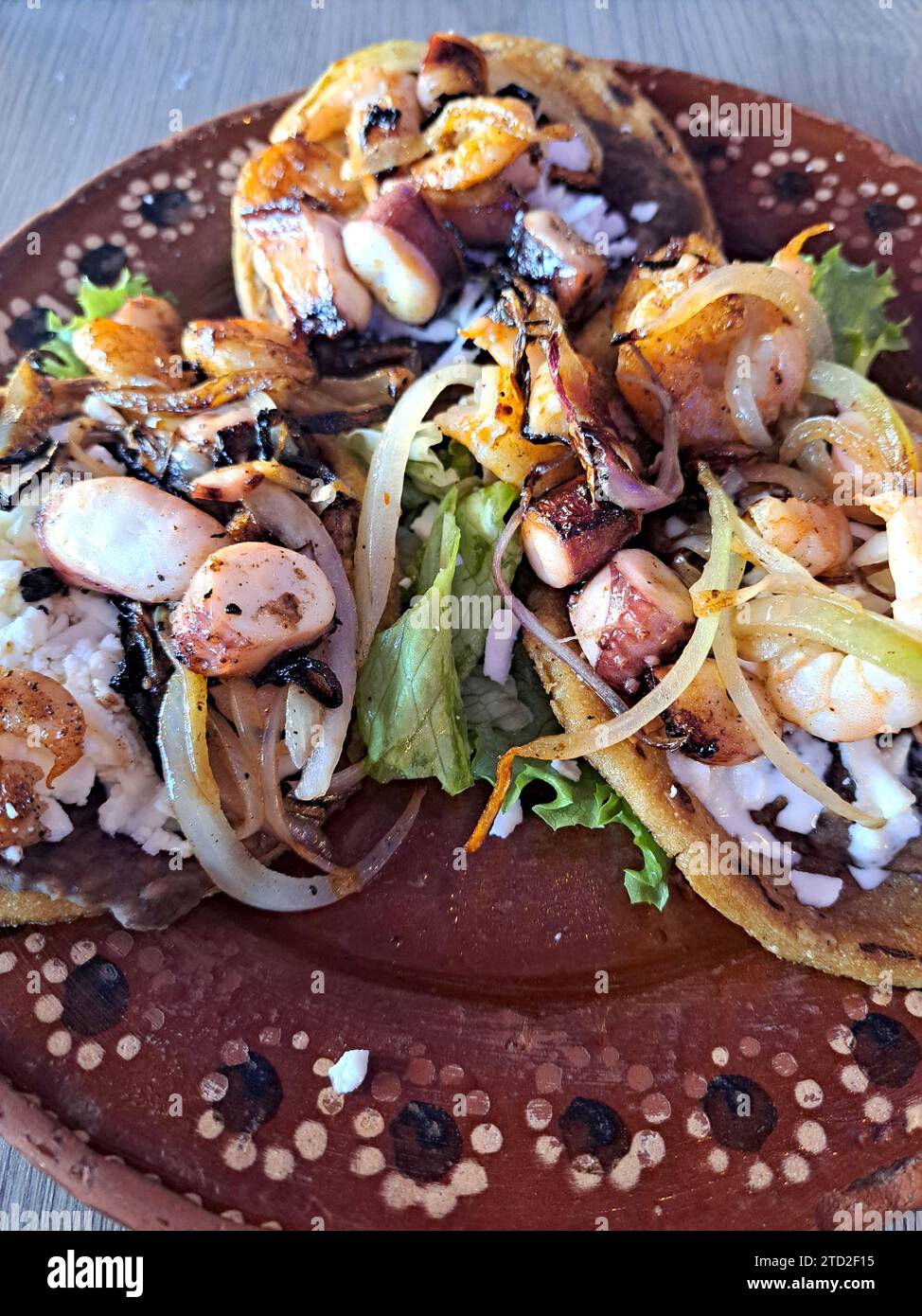 Delicious dish of Sopes and seafood tostadas that are a fried tortilla ...