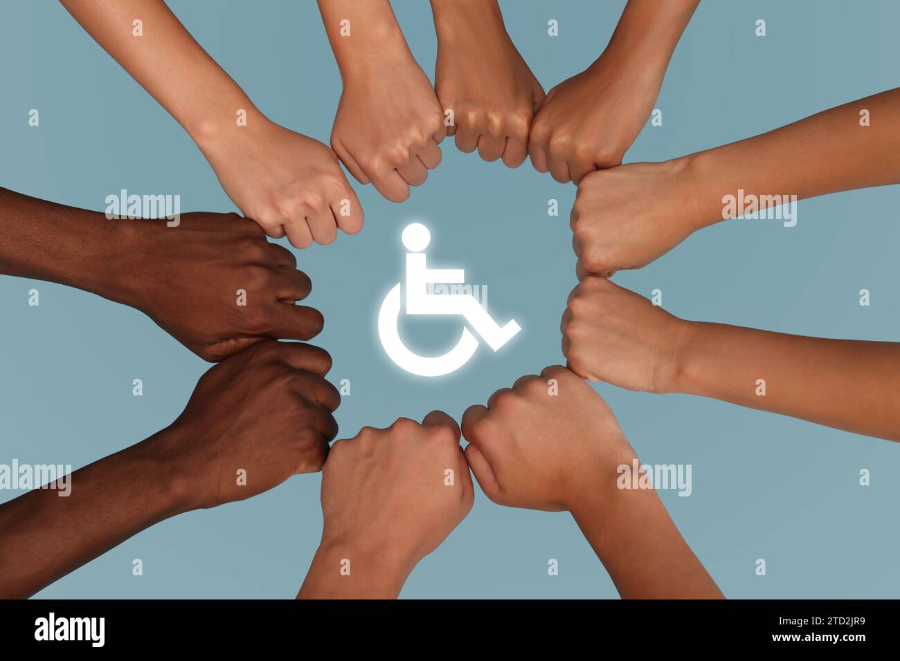 Inclusion concept. People holding fists together around international ...