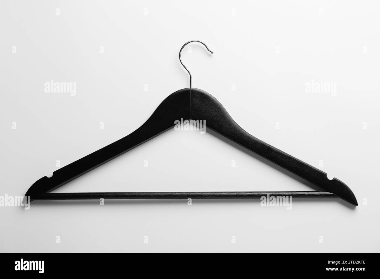 One black hanger on white background, top view Stock Photo - Alamy