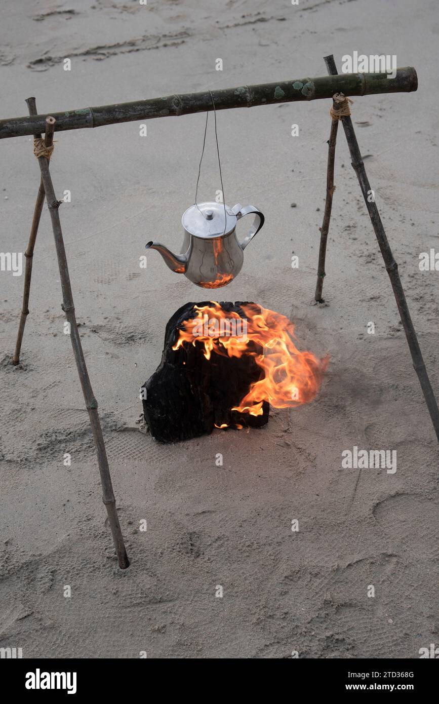 boiling water kettle on wood campfire by beach Stock Photo - Alamy