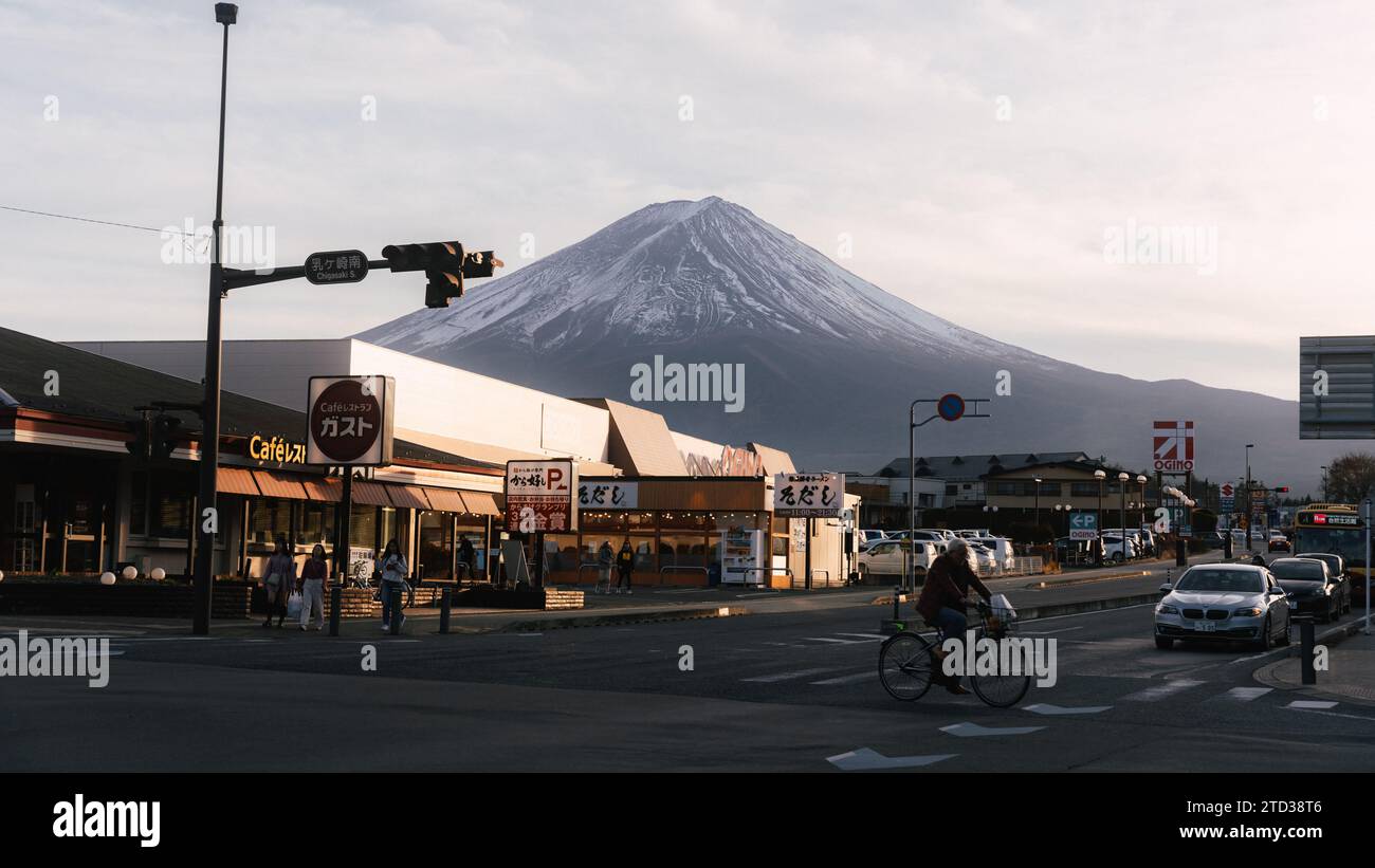 Beautiful scenery of Mount Fuji in the background and shops in front ...