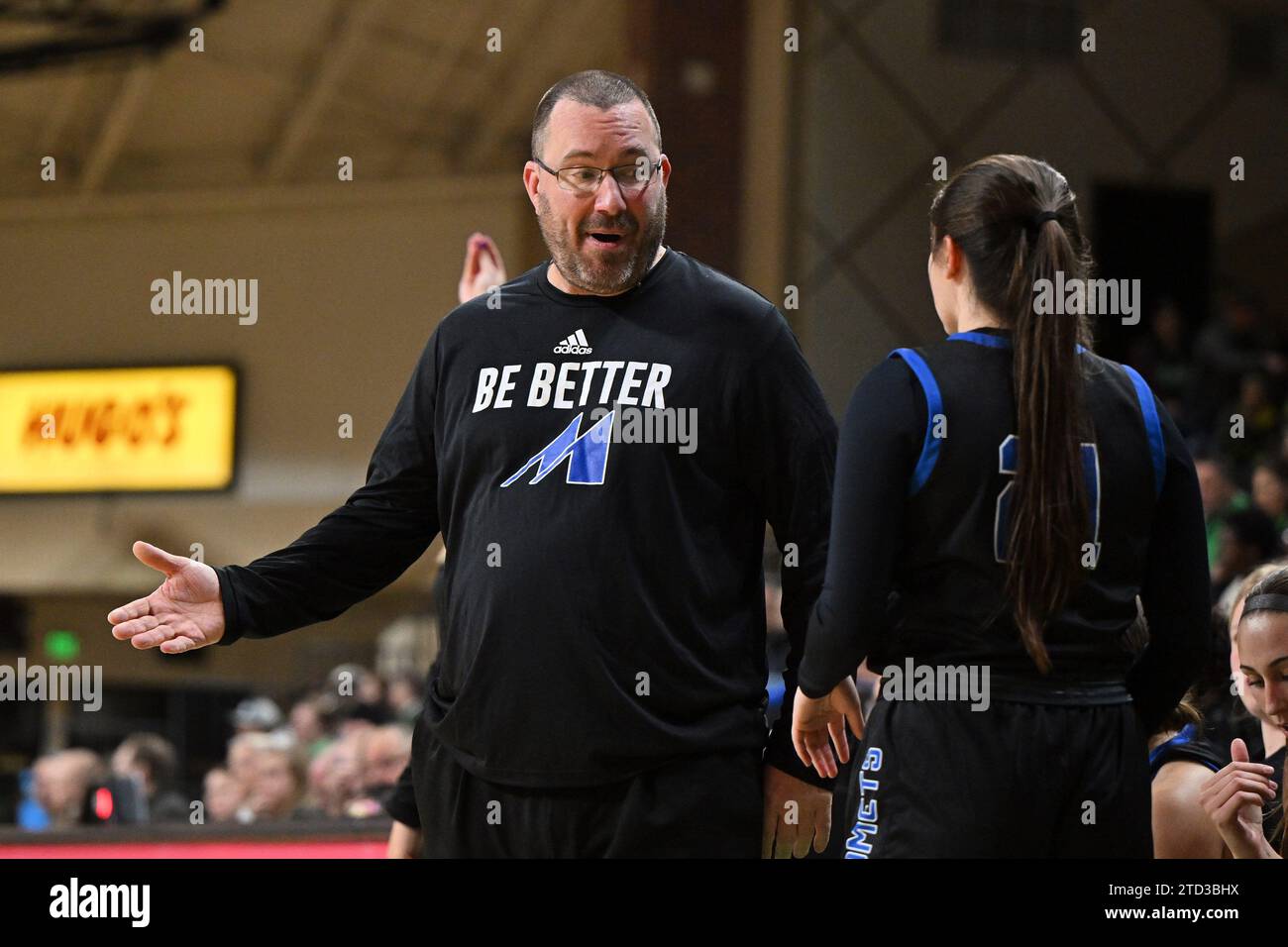 Mayville State Comets head coach Dennis Hutter talks to a player during ...