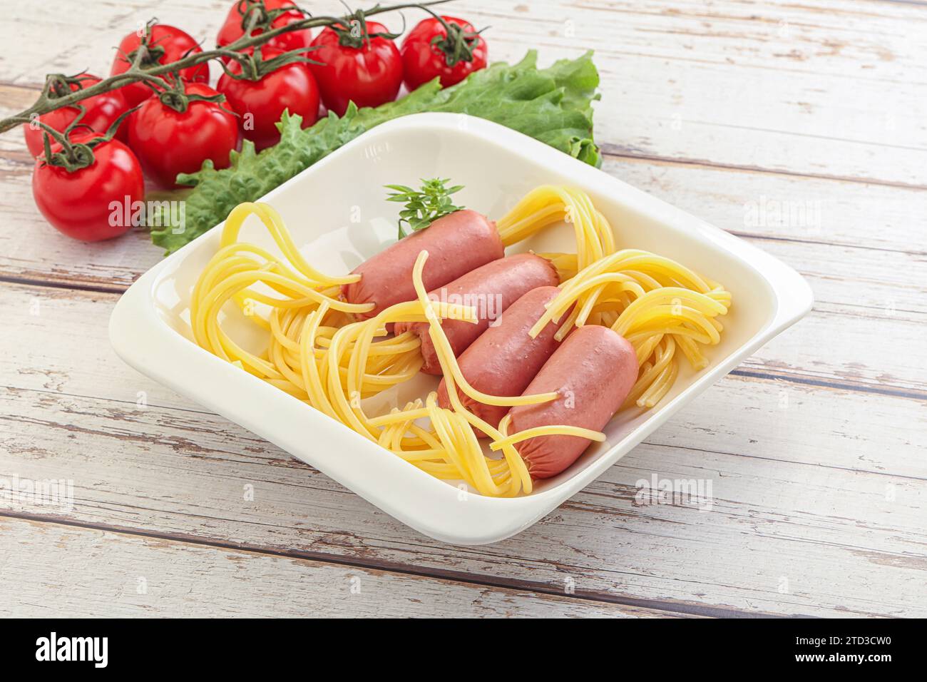Mini sausages with pasta spaghetti for kids Stock Photo - Alamy