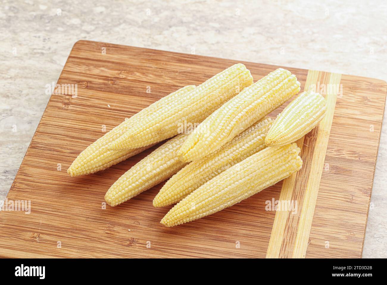 Raw natural organic baby corn heap Stock Photo - Alamy