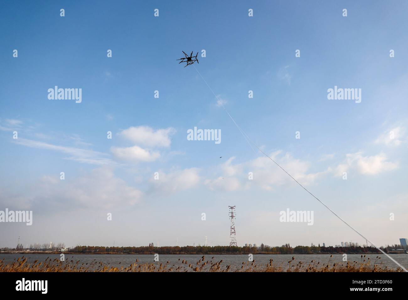 YANGZHOU, CHINA - DECEMBER 16, 2023 - At the site of a DC transmission line project, a ...