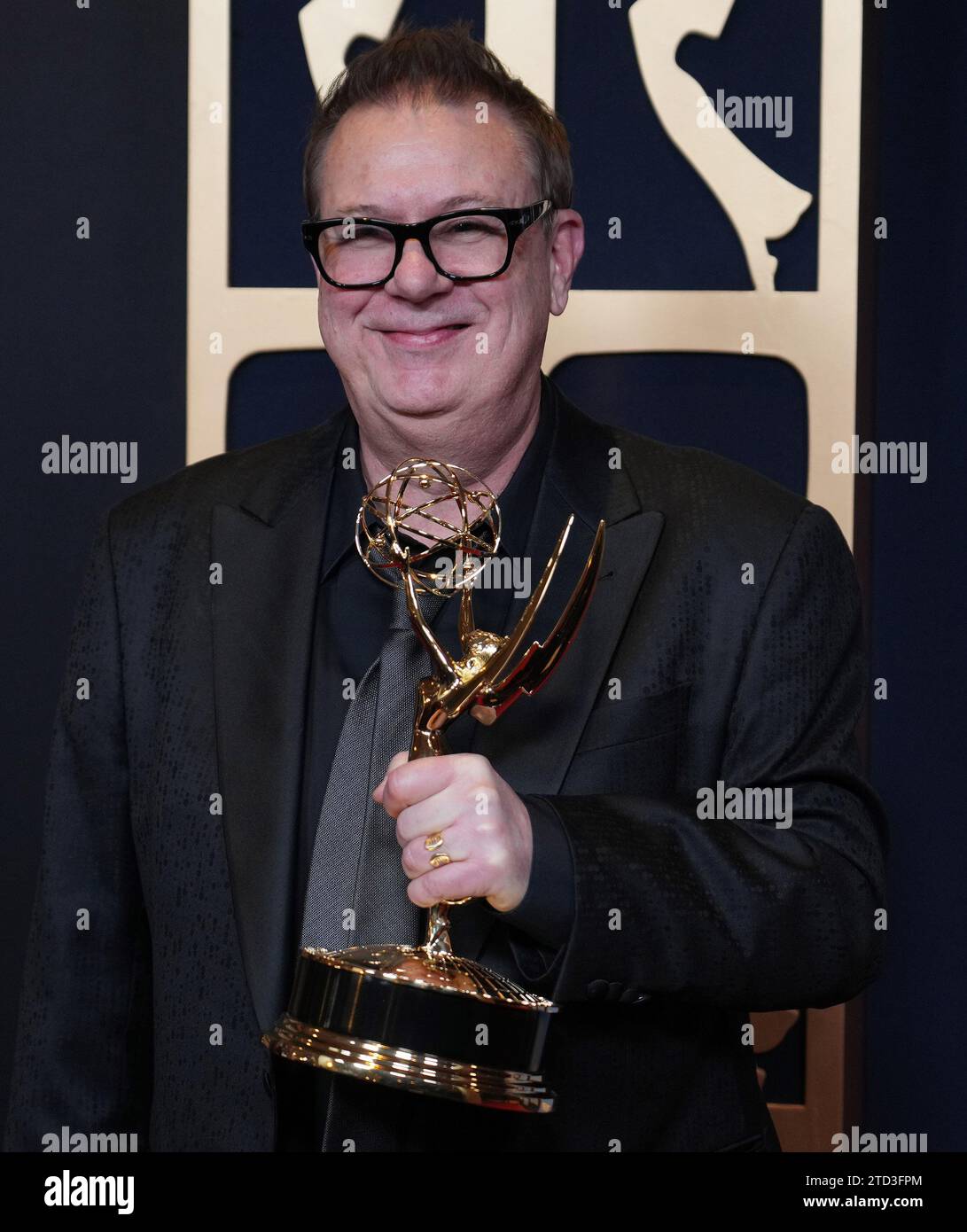 Josh Griffith poses with the award for outstanding writing team for a ...