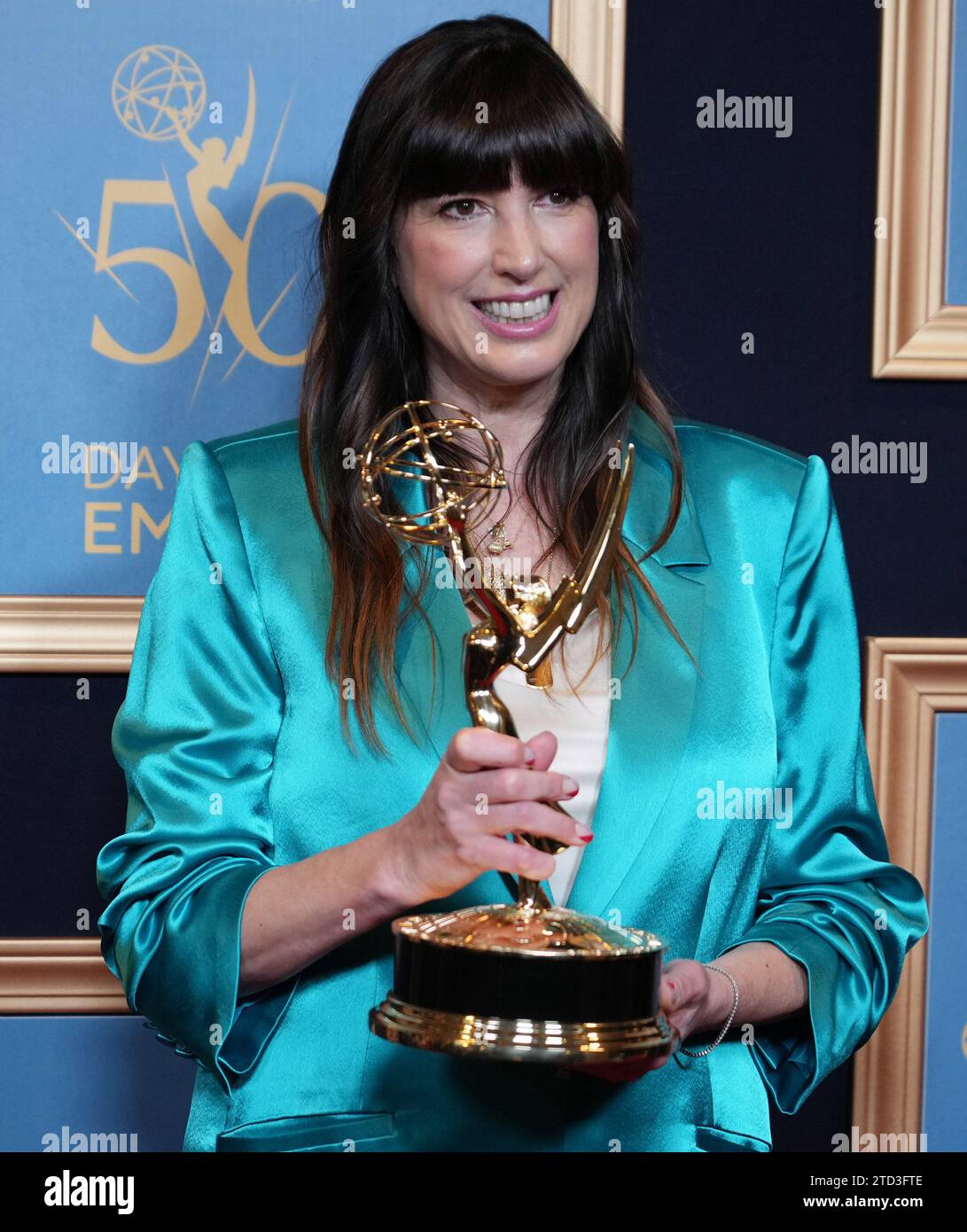 Alex Duda pose with the award for "Outstanding Daytime Talk Series" at ...