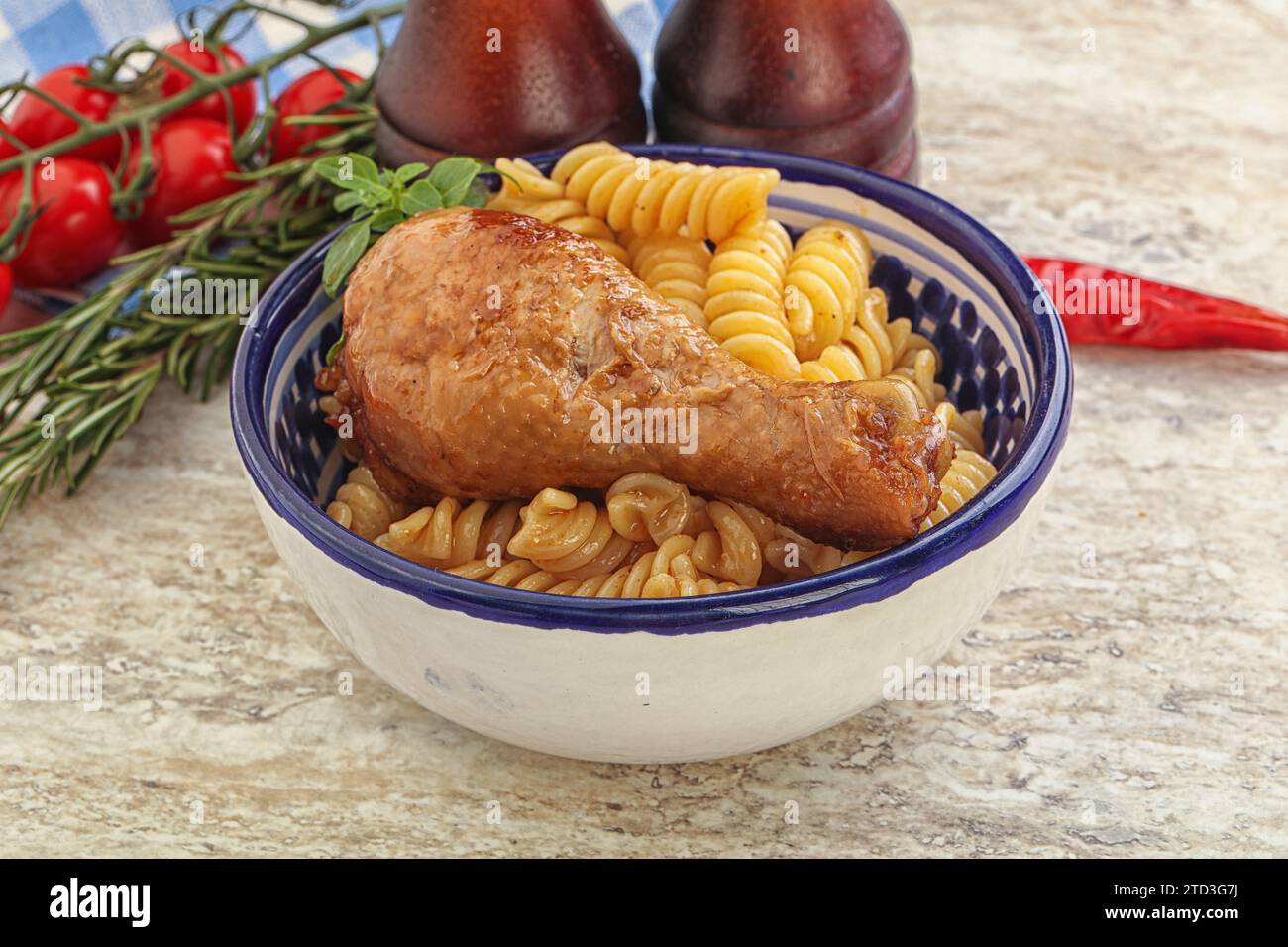 Roasted chicken leg with macaroni pasta Stock Photo - Alamy