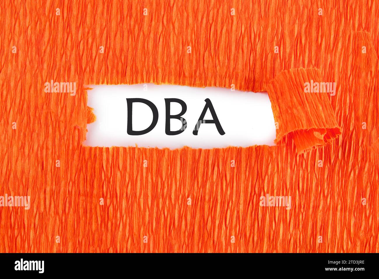DBA the text under the torn paper is orange on a white background Stock ...