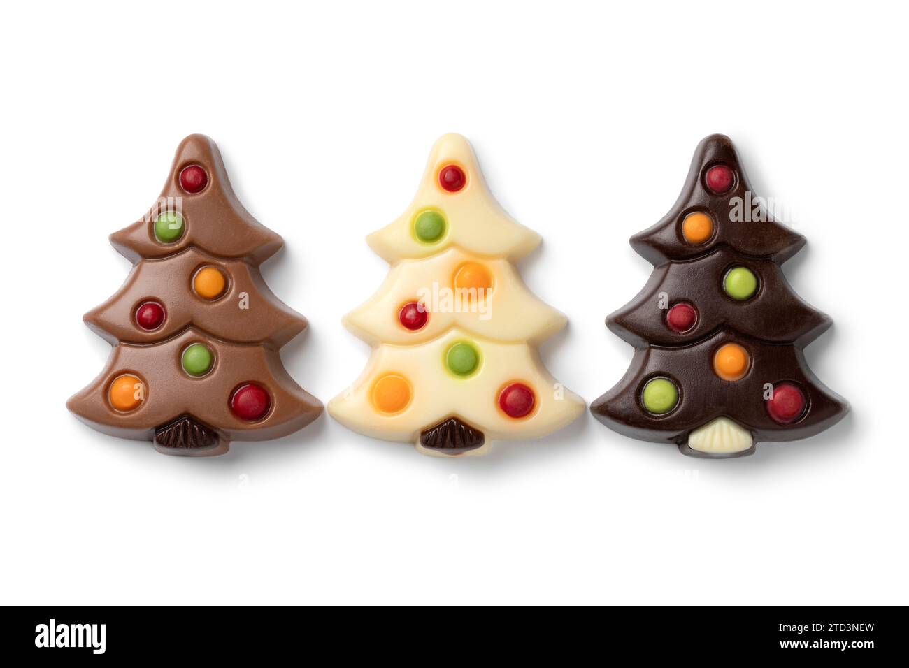 Chocolate christmas trees in a row isolated on white background close ...