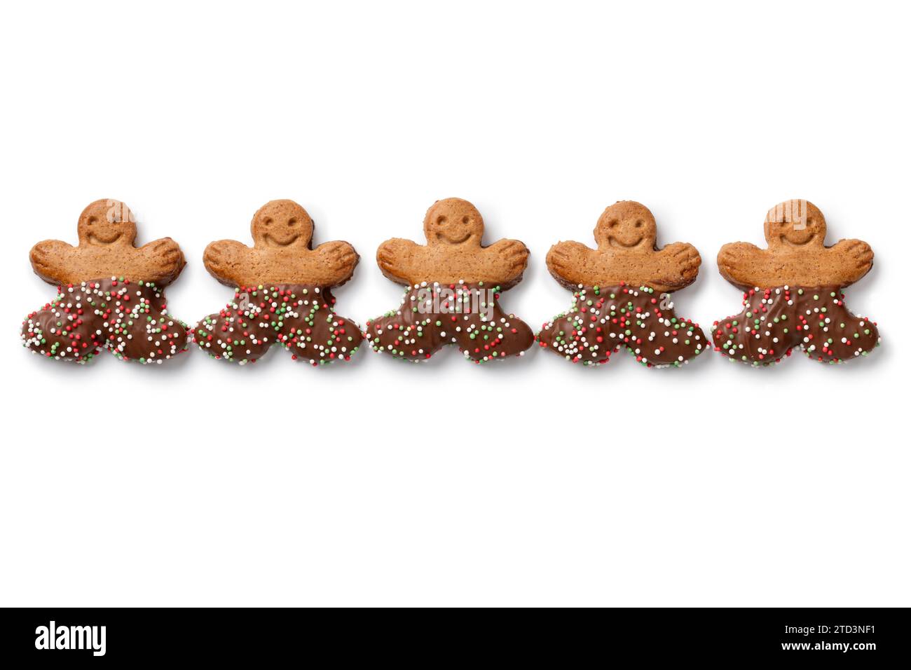 Happy chocolate ginger men cookies in a row isolated on white ...