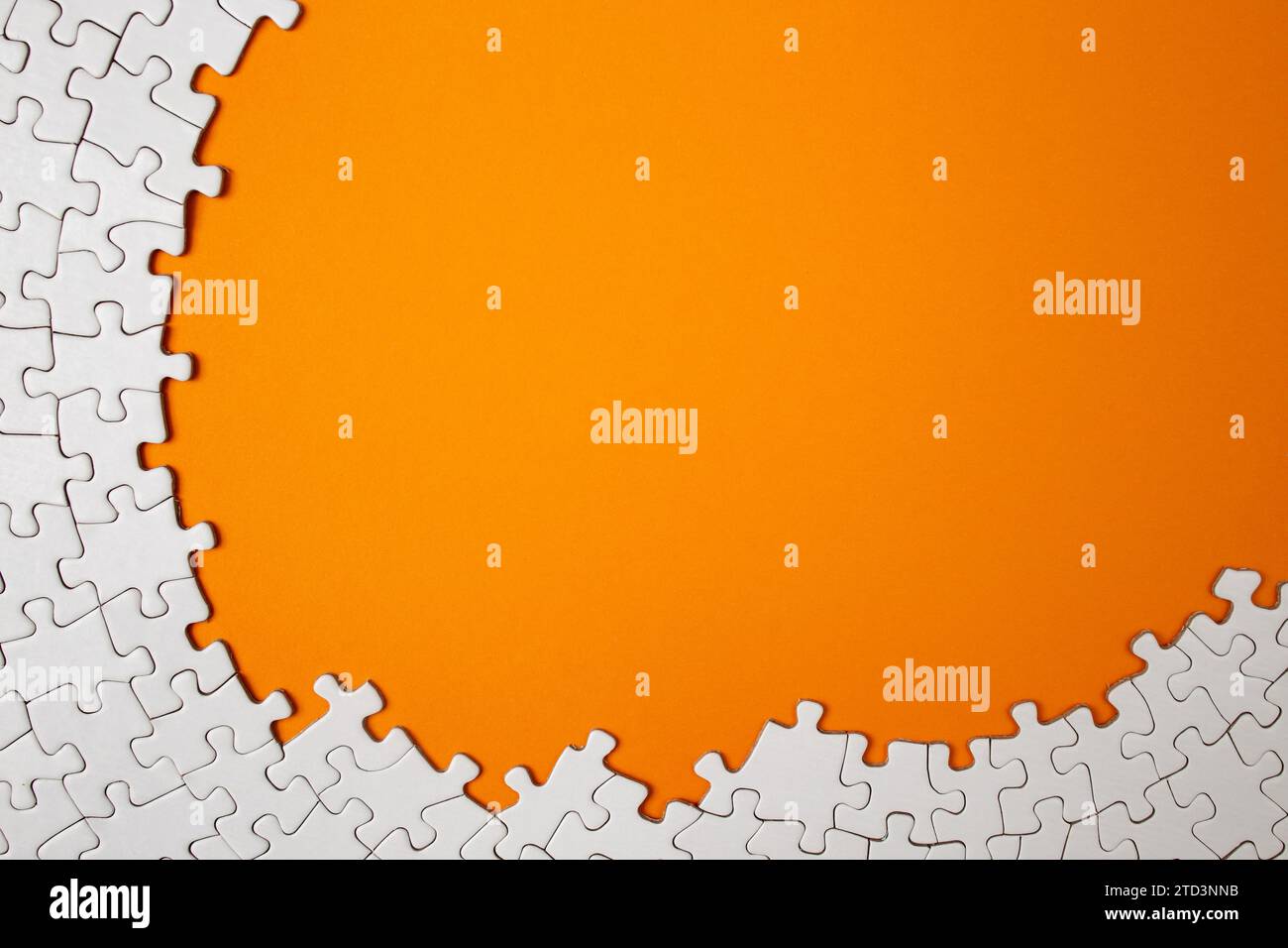 Plain white jigsaw puzzle frame on orange color background Stock Photo ...
