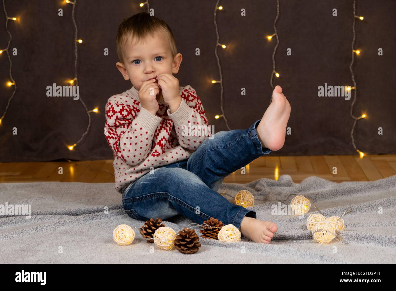 Cute little boy eating gingerbread. Christmas Kids Stock Photo - Alamy