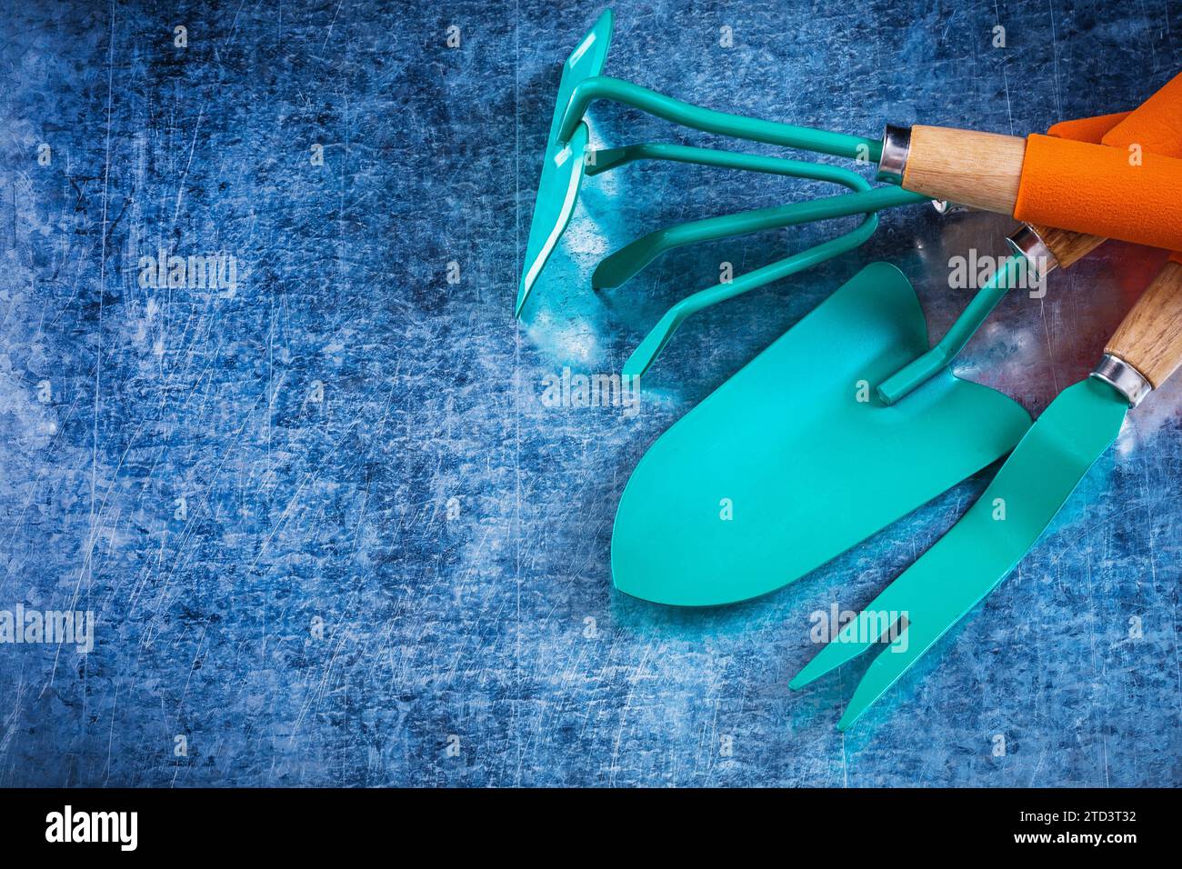 Weeding scoop hand spade rake gardening hoe on metallic background ...