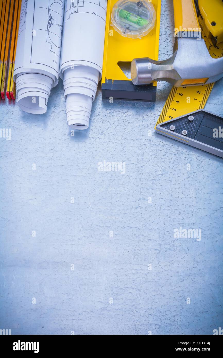 Vertical version of building working tools on metallic background ...