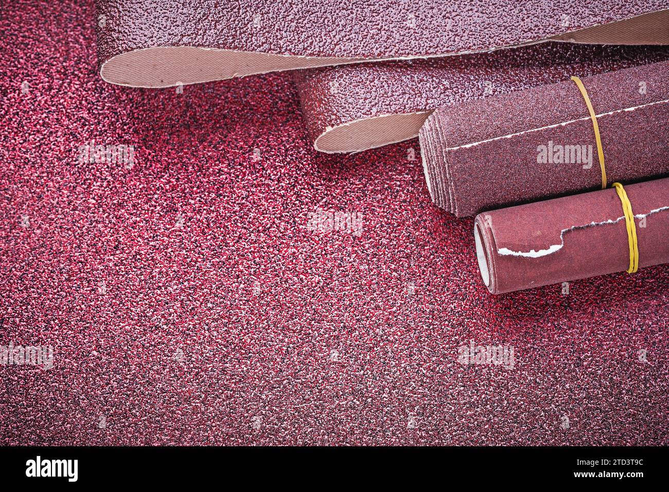 Sandpaper rolls on polishing sheet horizontal image Stock Photo - Alamy