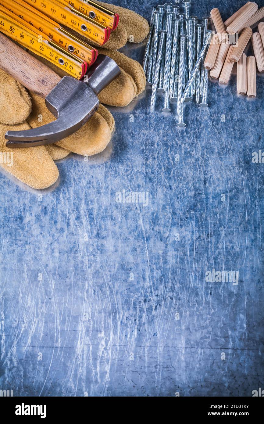 Hammer protective gloves wooden metre stack of metal nails and dowels ...