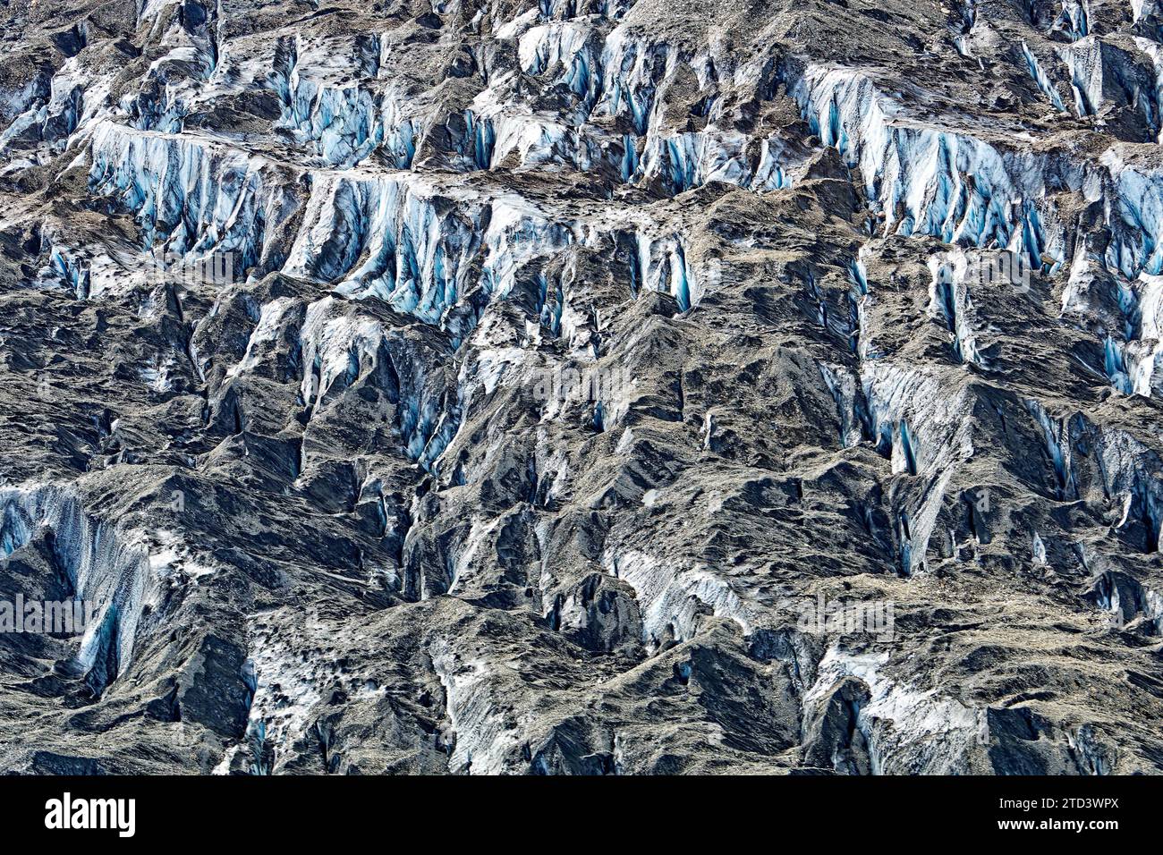 Aerial view of Kaskawulsh Glacier with crevasses and moraine deposits ...