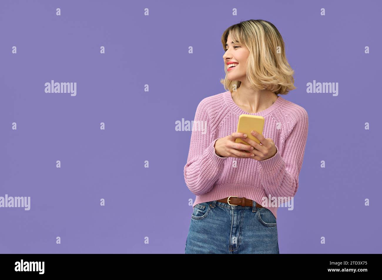 Happy pretty gen z blonde girl holding smartphone looking at copy space ...